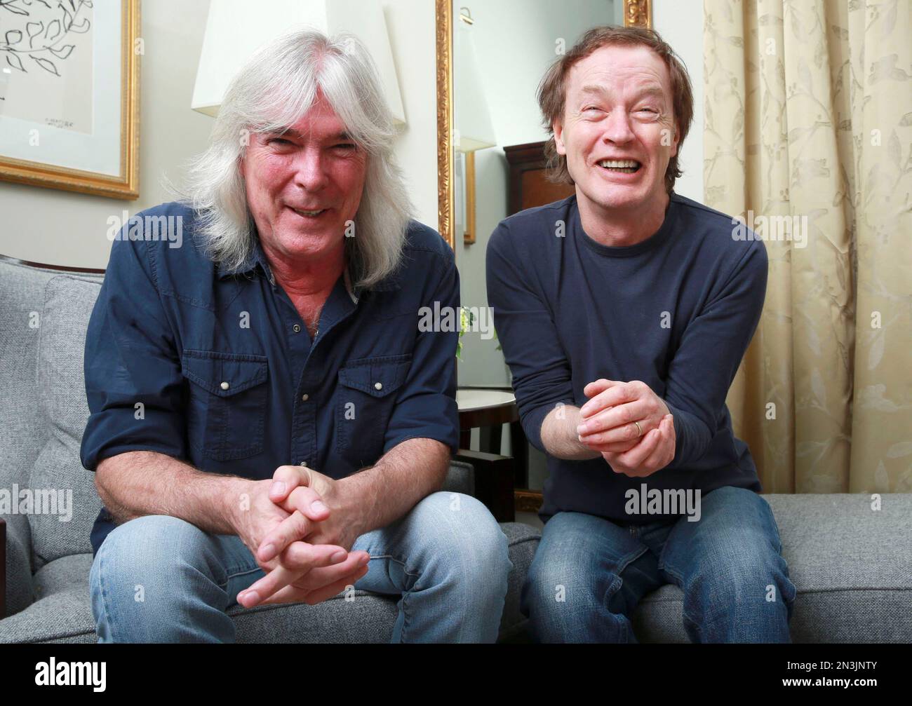 Members of the rock band AC/DC, bassist Cliff Williams and guitarist ...