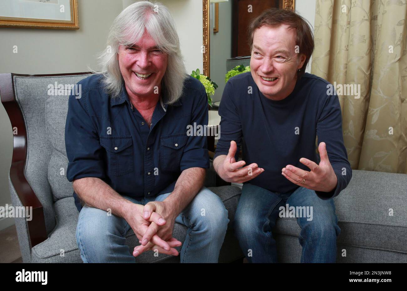Members of the rock band AC/DC, bassist Cliff Williams and guitarist ...