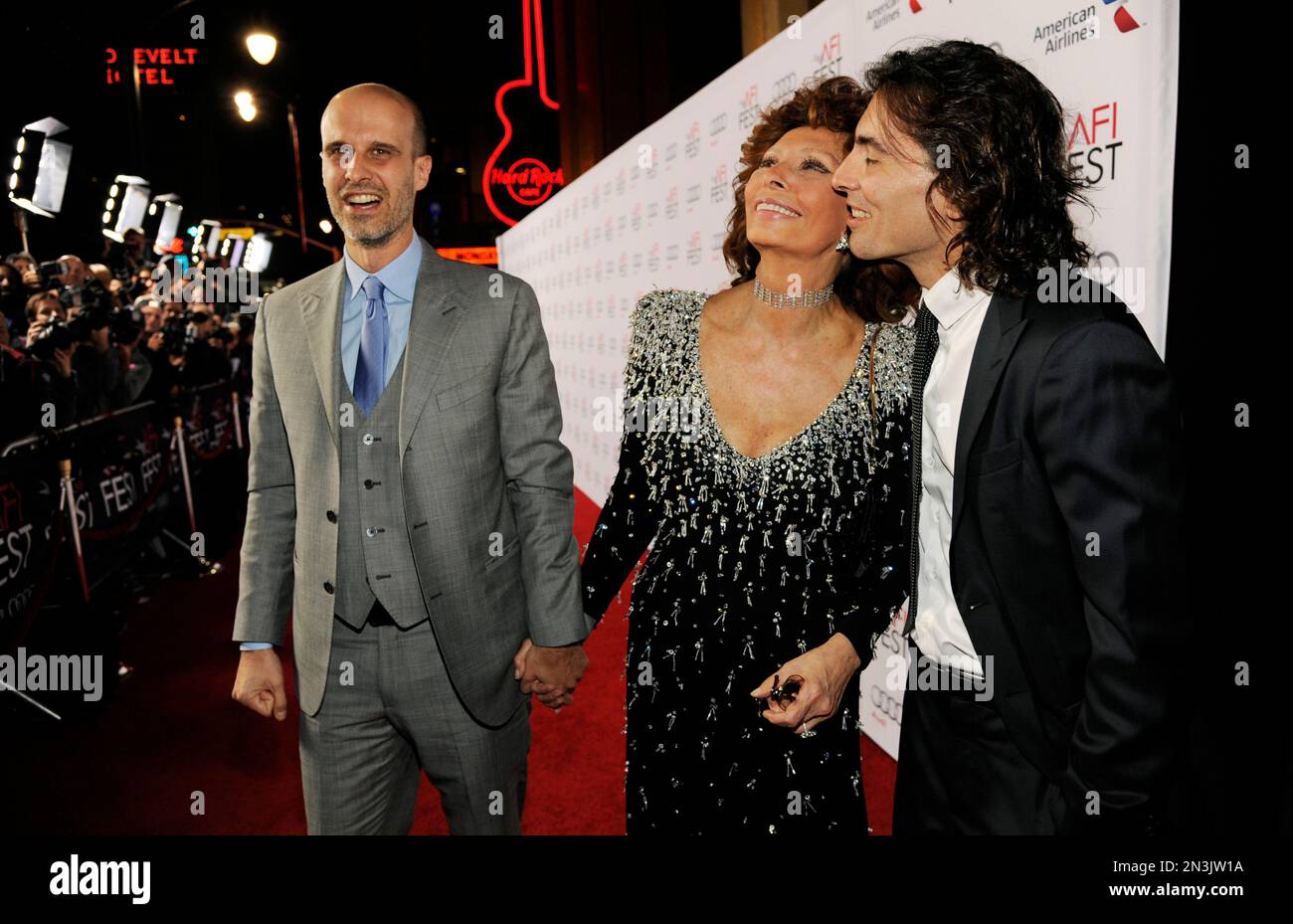 Italian actress Sophia Loren, center, arrives with her sons Edoardo Ponti, left, and Carlo Ponti ...