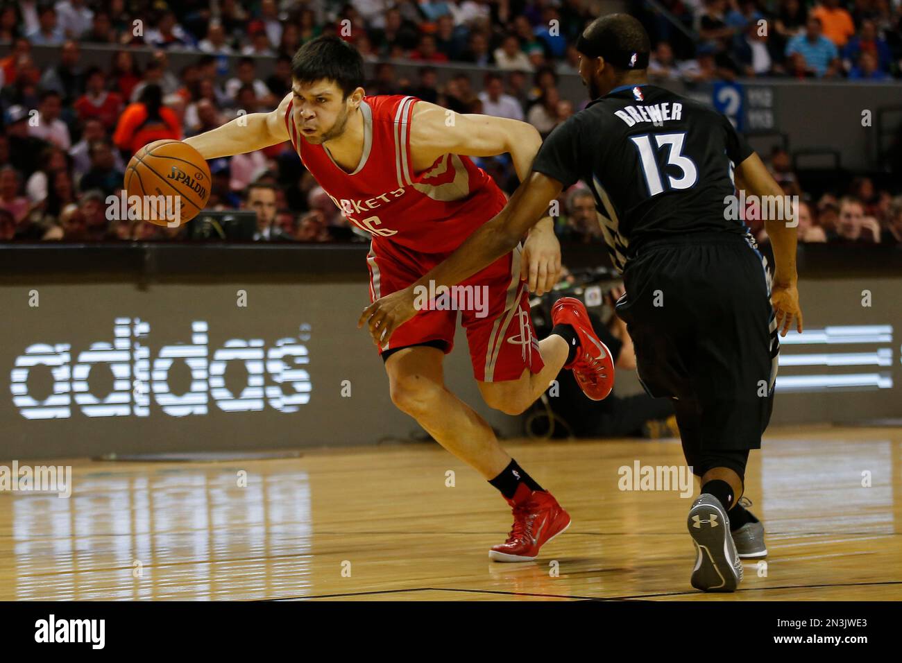Houston Rockets' Kostas Papanikolau (16), left, drives past Minnesota ...
