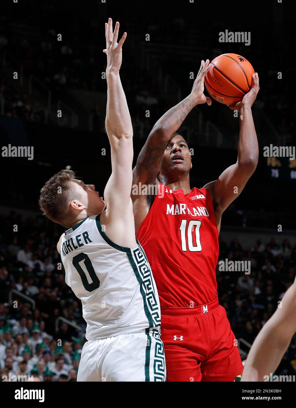 Maryland's Julian Reese, right, shoots against Michigan State's Jaxon ...