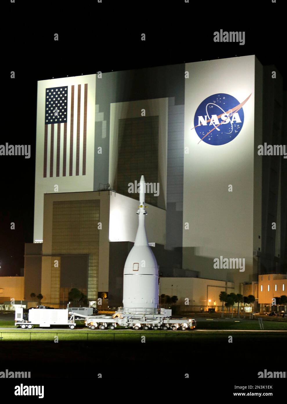 The Orion Spacecraft moves by the Vehicle Assembly Building on its ...