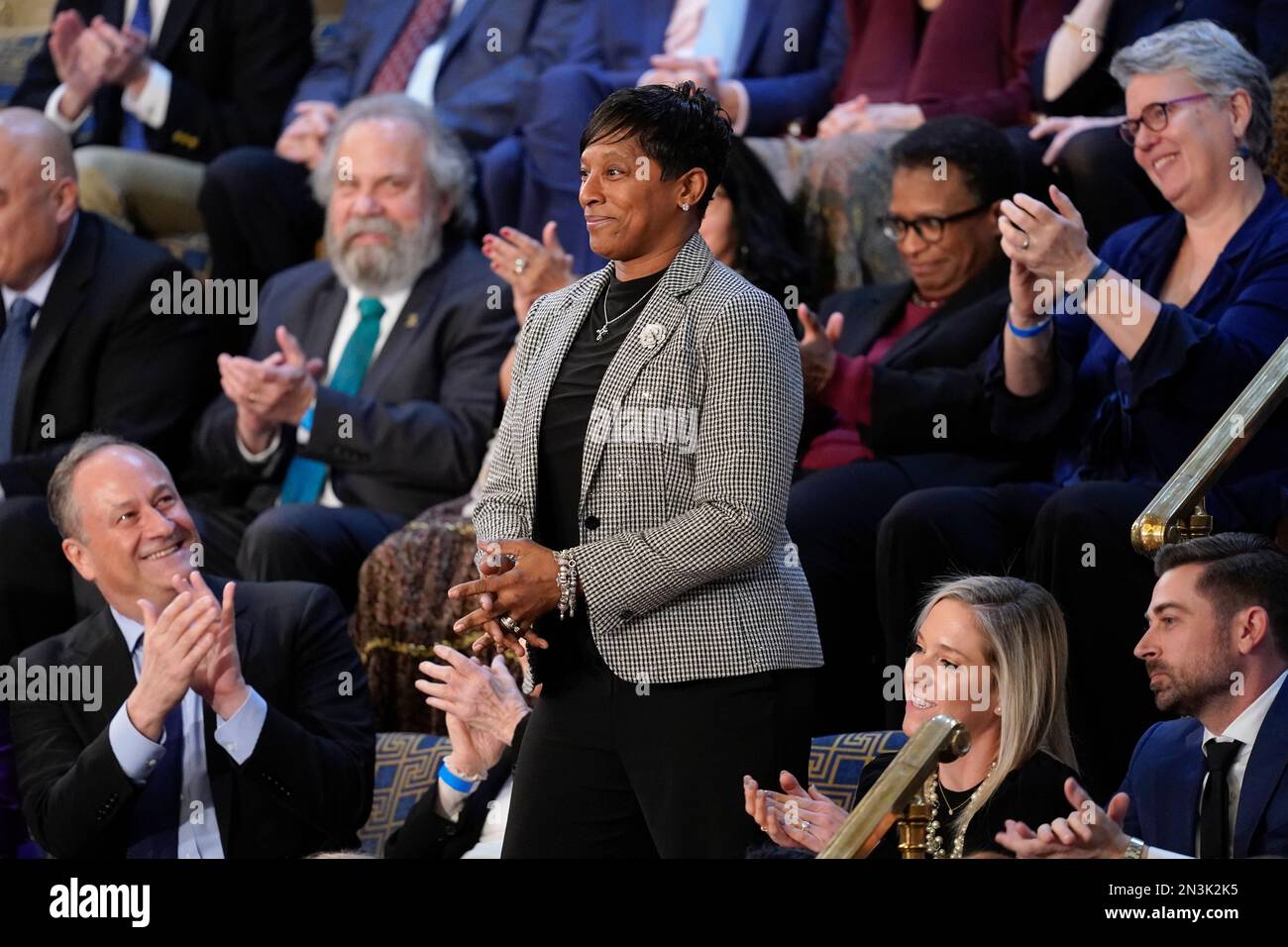 Saria Gwin-Maye, of Cincinnati, stands as she is recognized by ...