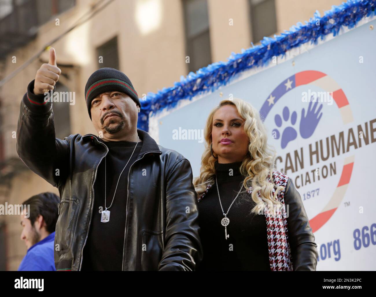 Rapper Ice-T gives a thumbs up with his wife Coco at his side as they ...