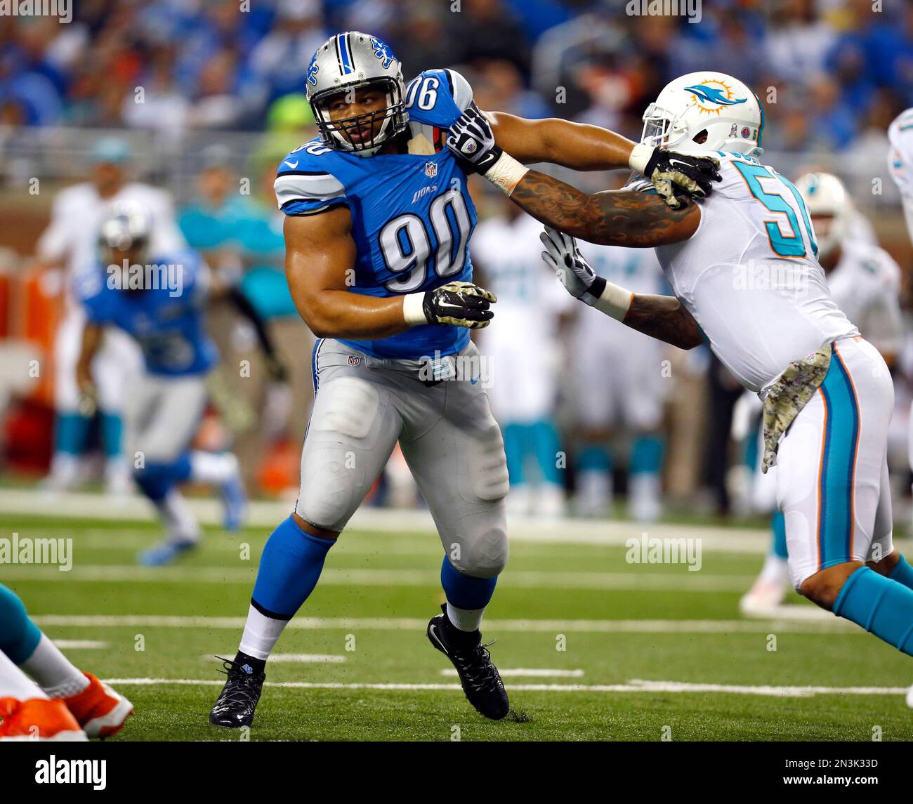 Detroit Lions defensive tackle Ndamukong Suh (90) battles with Miami ...