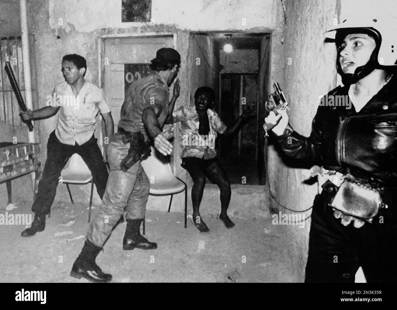 Three Rio police officers confront local favela dwellers, protesting ...