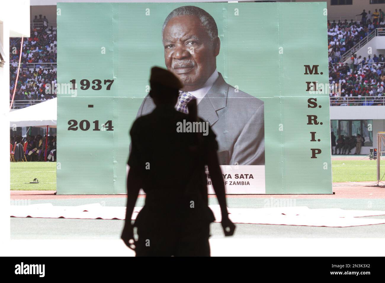 An armed soldier enters the stadium where the coffin of the late ...
