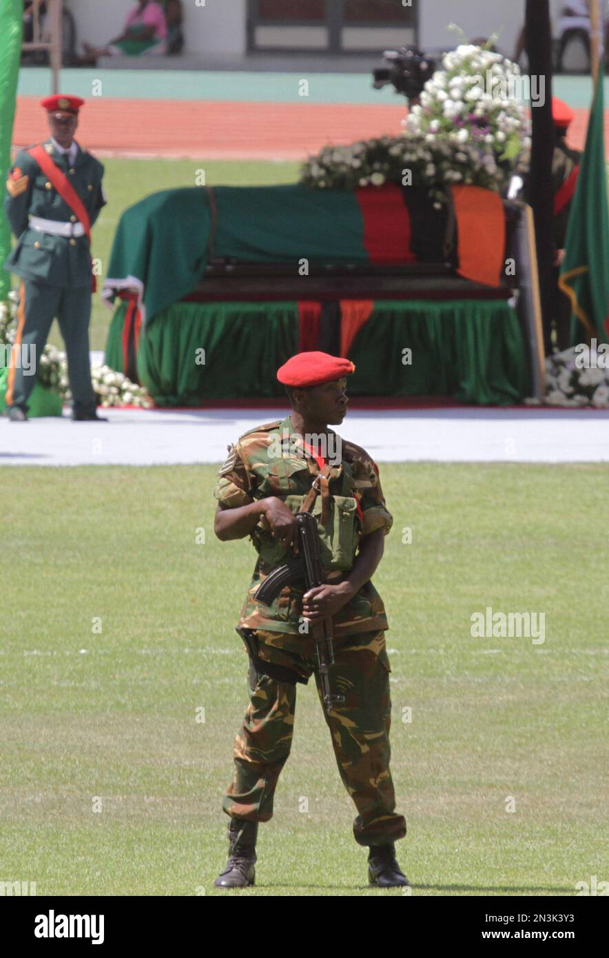 An armed soldier stands near the coffin of the late Zambian President ...