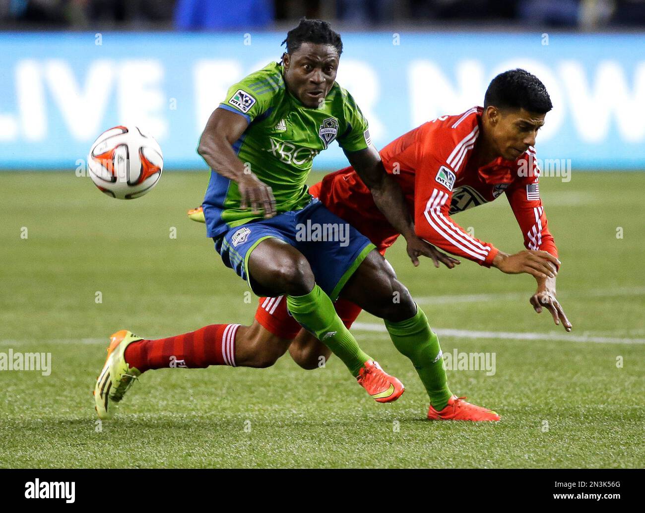 Seattle Sounders' Obafemi Martins, left, tangles for the ball with FC ...
