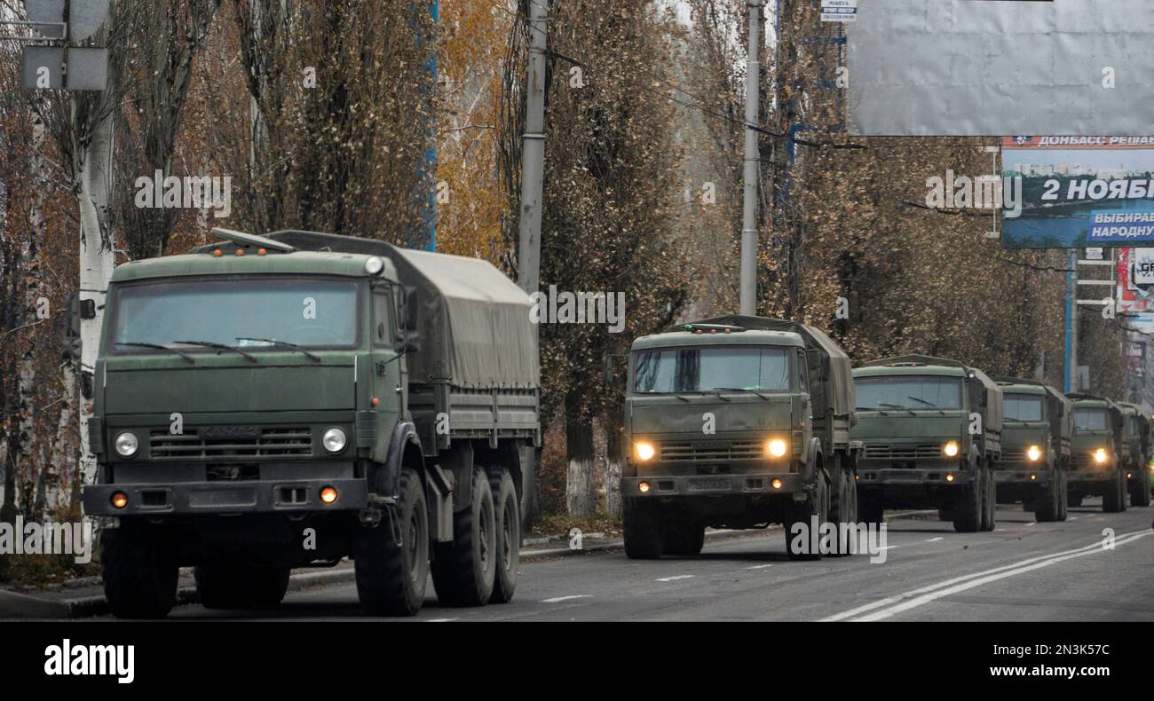 A convoy of unmarked military vehicles is in downtown Donetsk on ...