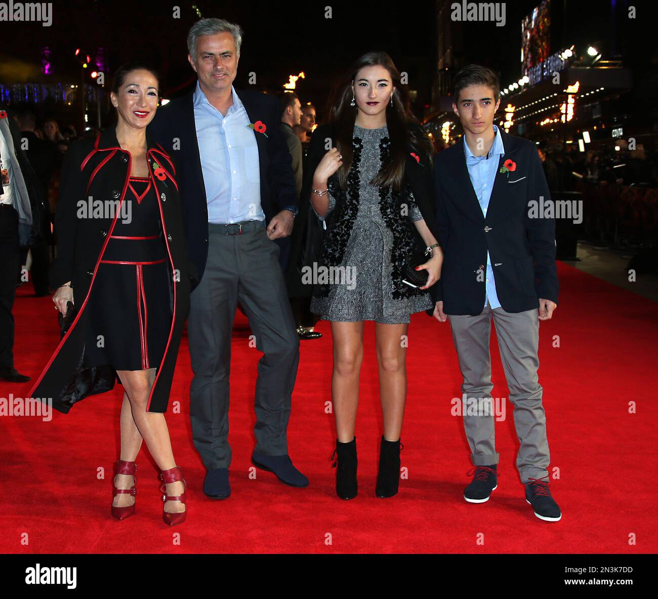 Jose Mourinho, second from left, and family pose for photographers upon ...