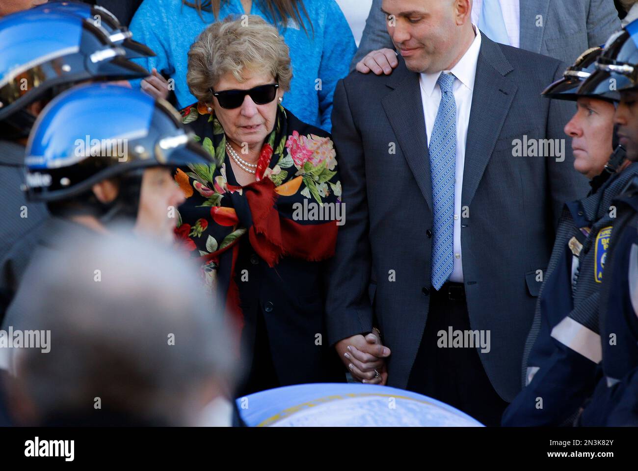 Angela Menino, center, stands behind her husband's casket, former ...