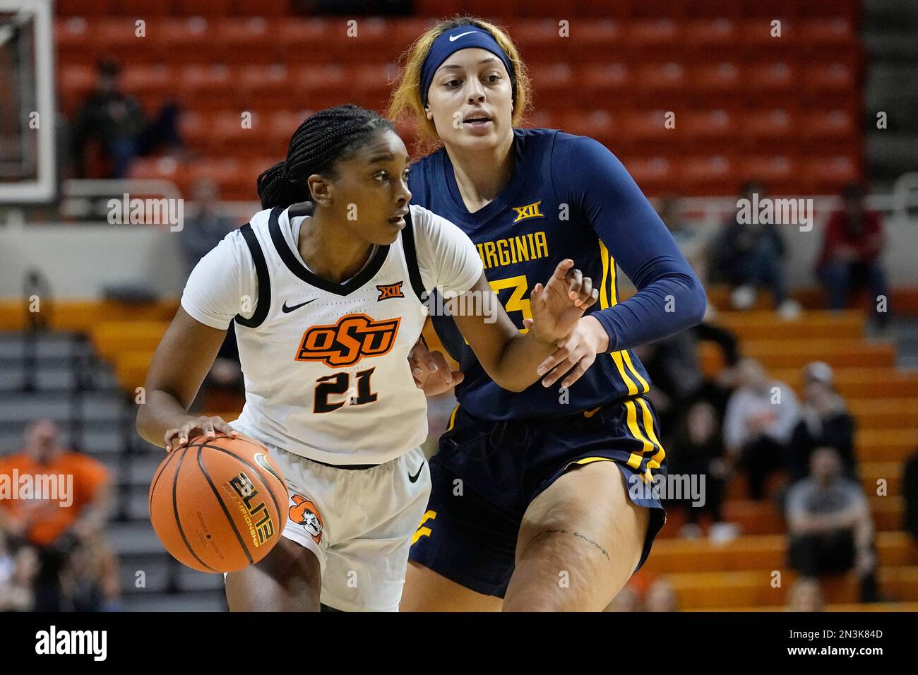 Oklahoma State guard Terryn Milton (21) drives past West Virginia ...