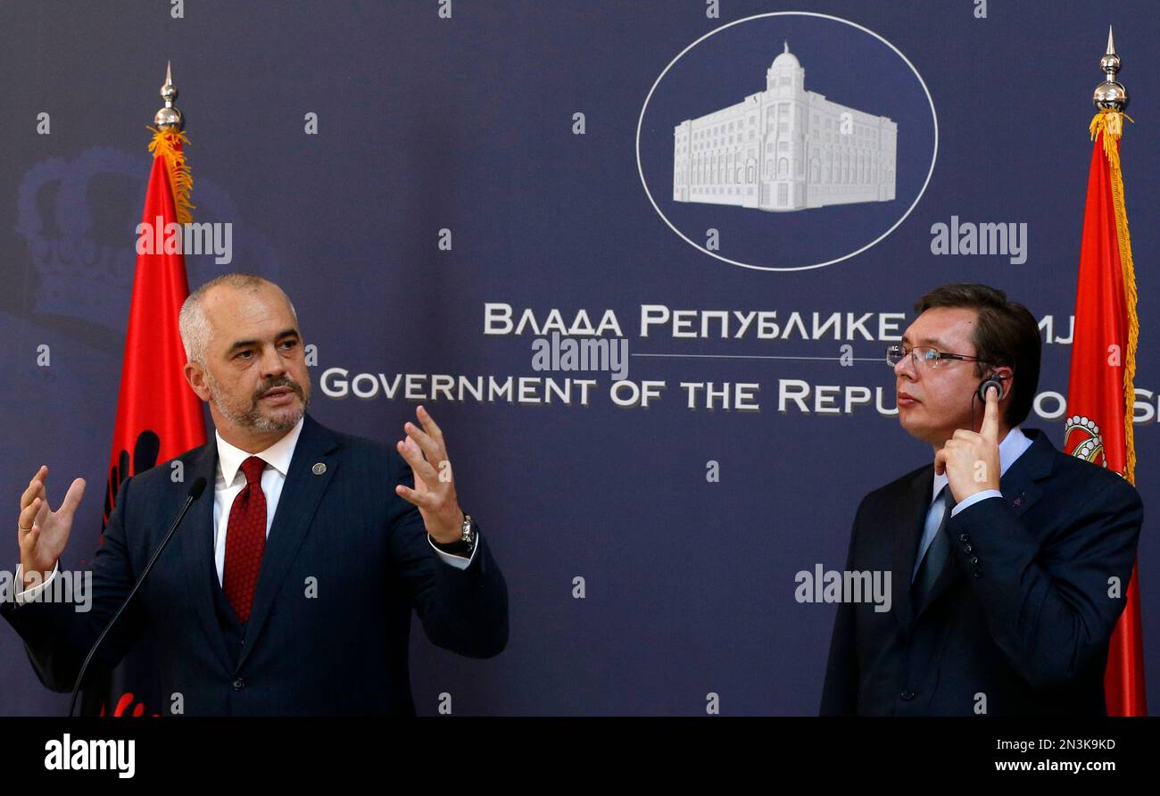 Serbian Prime Minister Aleksandar Vucic, right listens his Albanian ...