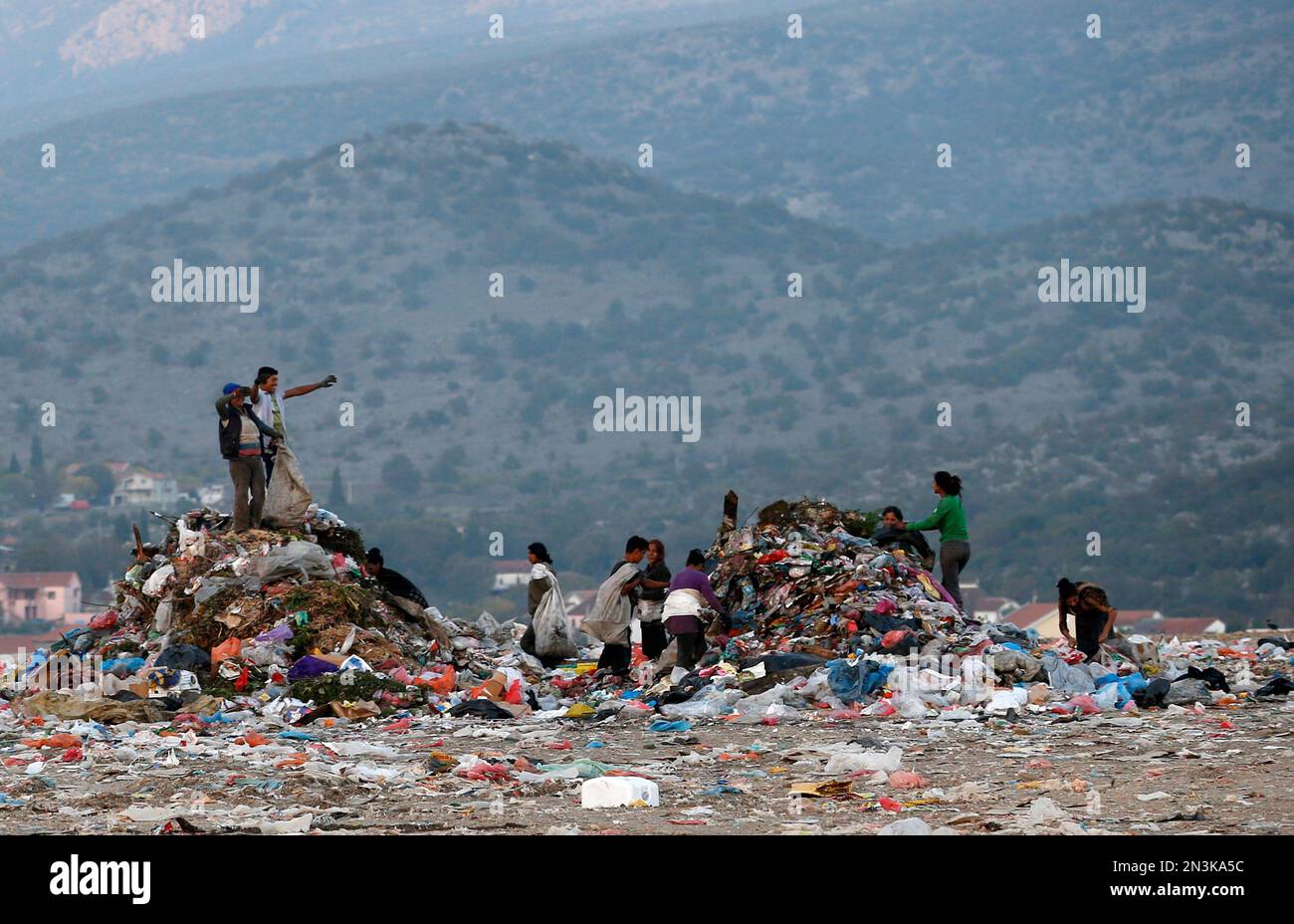 In this photo taken Monday, Nov. 3, 2014, Gypsies collect plastic ...