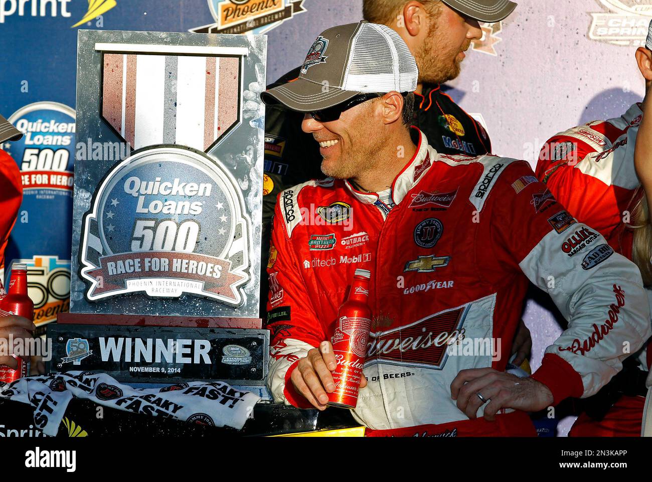 Driver Kevin Harvick celebrates in victory lane after winning the ...