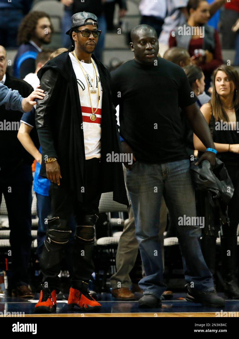 Hip Hop artist 2 Chainz, left, stands with an unidentified person ...