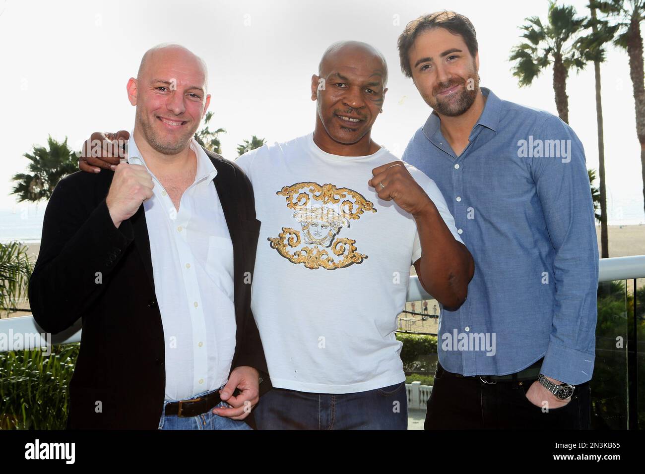 Laurence Gornall, and from left, Mike Tyson and Bert Marcus are seen at ...