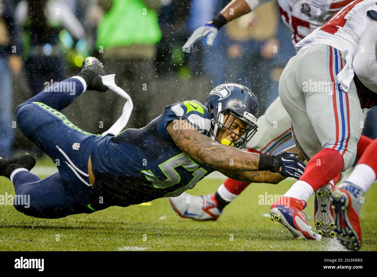 Seattle Seahawks outside linebacker Bruce Irvin tackles New York Giants ...
