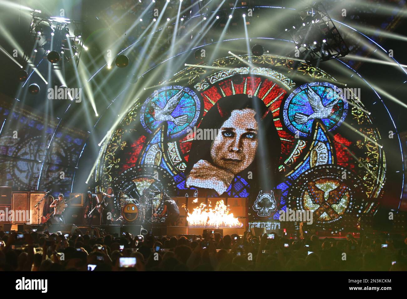 From left, Simon Neil, Miles Kennedy and Slash perform during the 2014 ...