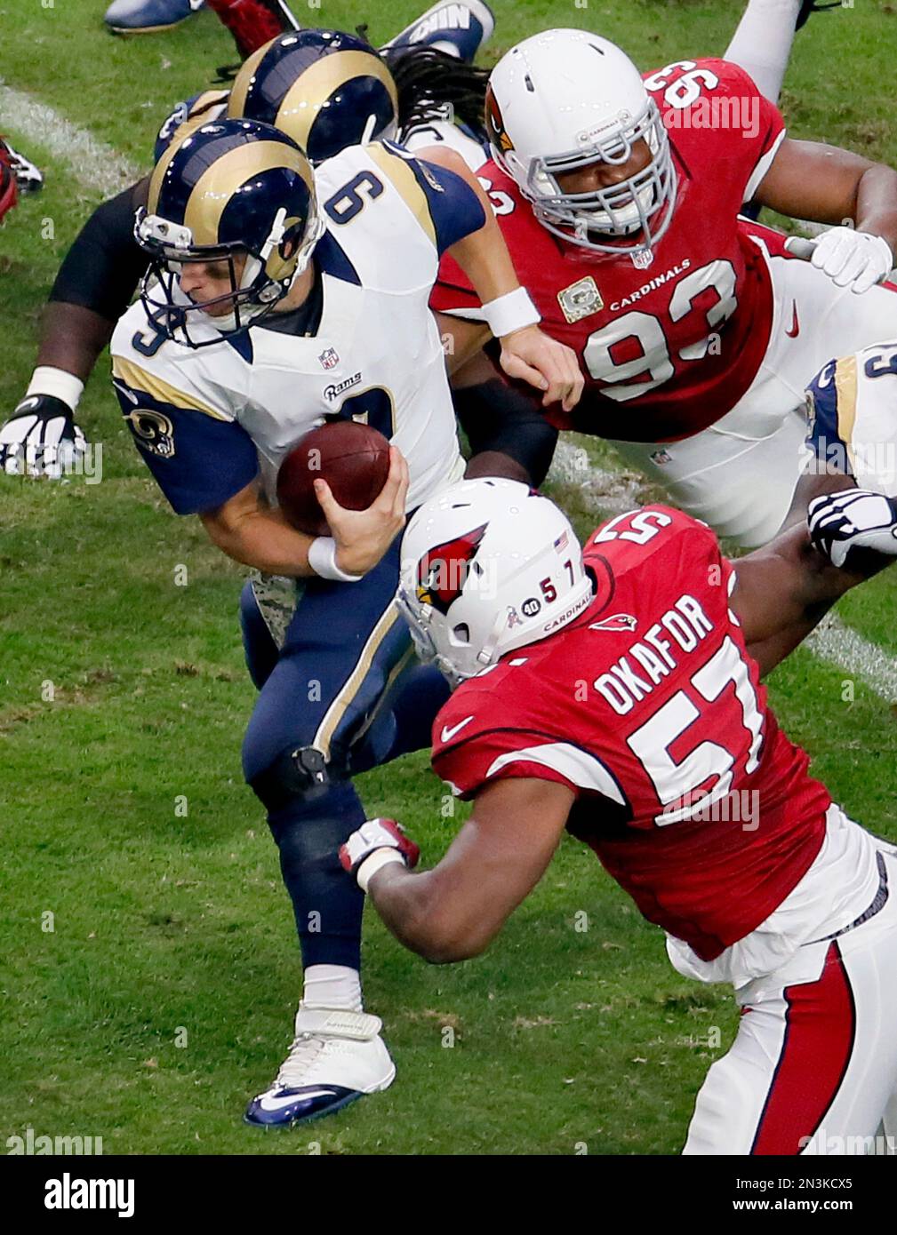 St. Louis Rams quarterback Austin Davis (9) looks for room as Arizona ...