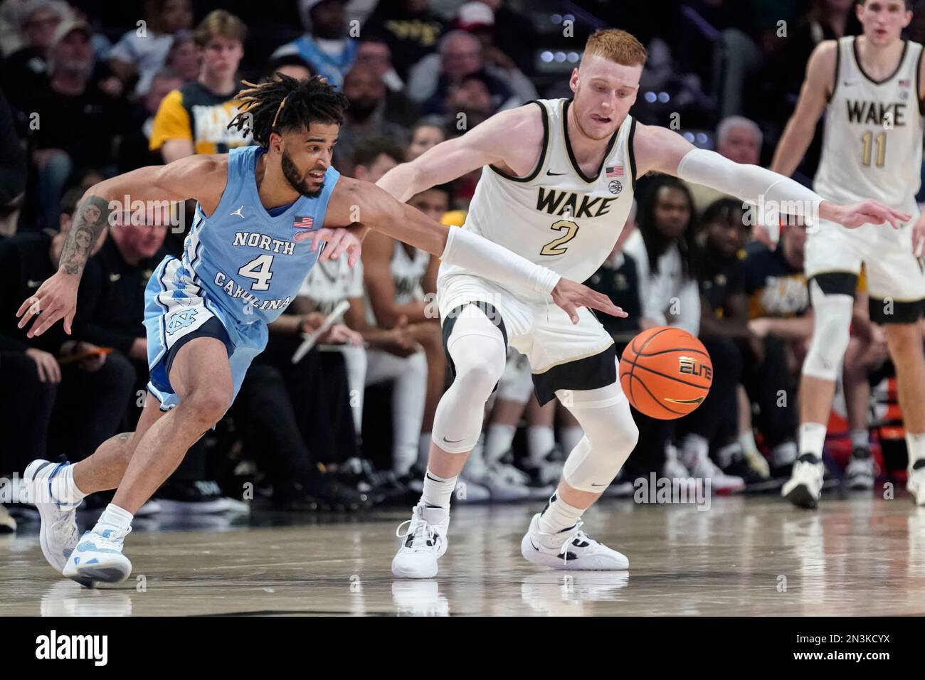 Wake Forest guard Cameron Hildreth (2) and North Carolina guard R.J ...