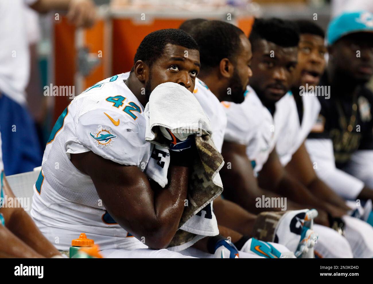 Miami Dolphins tight end Charles Clay (42) watches from the bench in ...