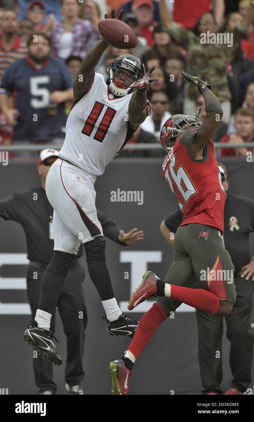 Tampa Bay Buccaneers cornerback Crezdon Butler (26) knocks the ball ...
