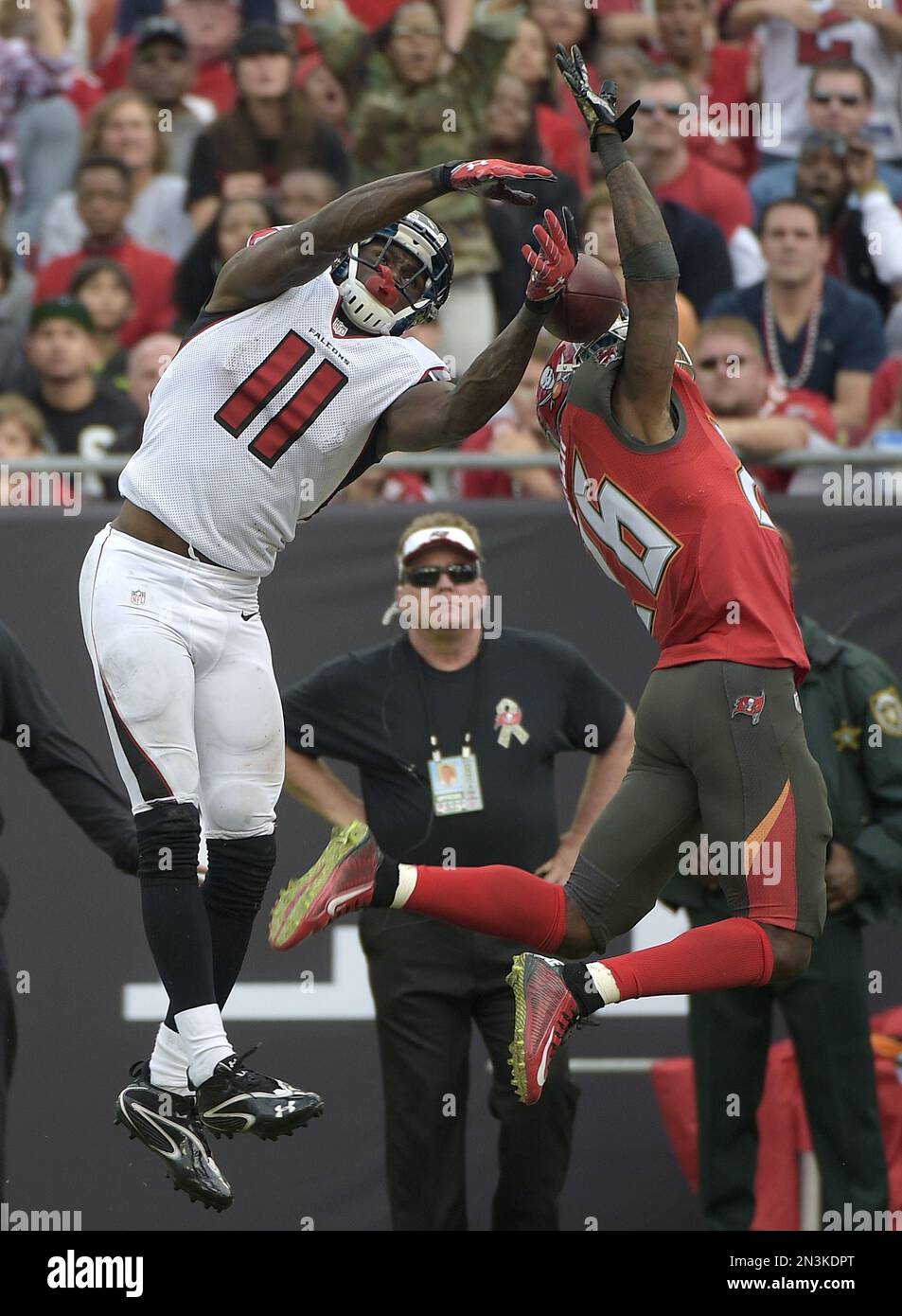 Tampa Bay Buccaneers cornerback Crezdon Butler (26) knocks the ball ...
