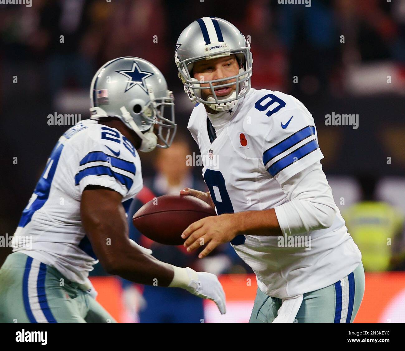 Dallas Cowboys quarterback Tony Romo (9) rolls out against the ...