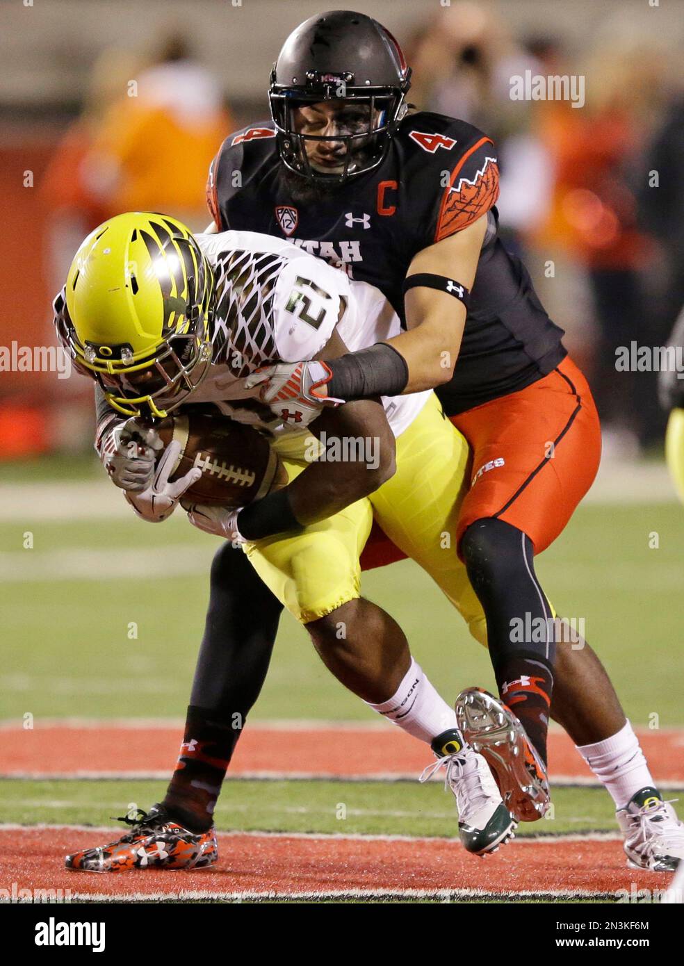 Utah defensive back Brian Blechen (4) tackles Oregon running back Royce ...
