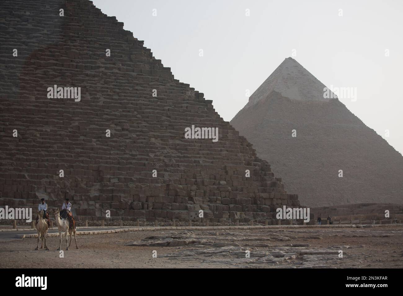 Security guards ride camels at the Pyramids of Giza on the outskirts of ...
