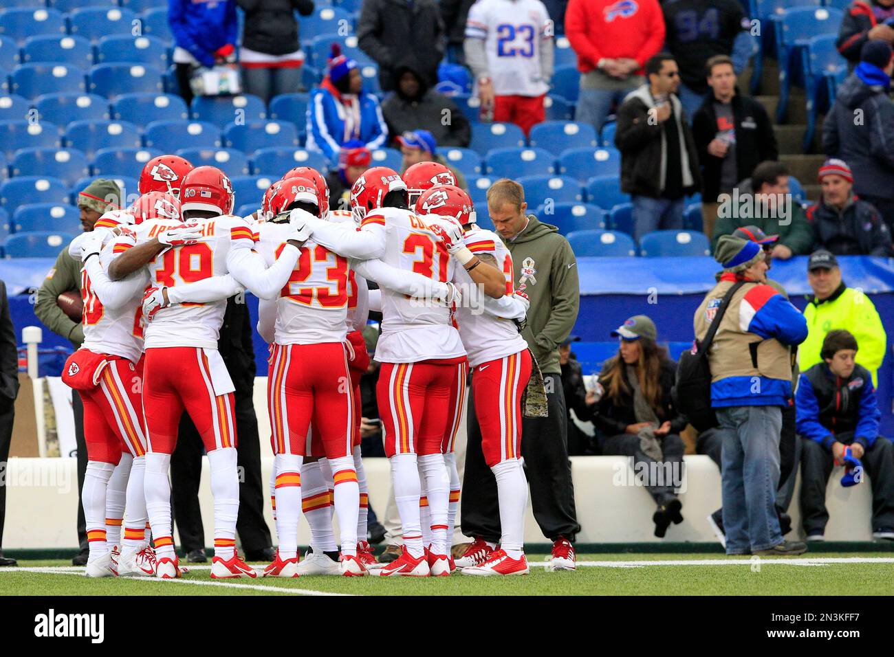 Kansas City Chiefs players huddle prior to an NFL football game against ...