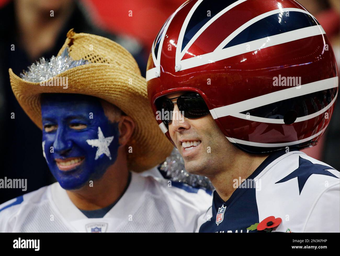 Dallas Cowboys' fans pose before the NFL football game between the ...