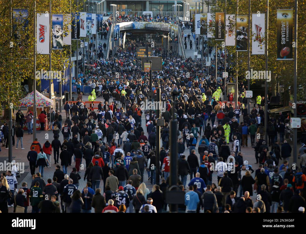 Fans arrive at Wembley Stadium for the NFL football game between the ...