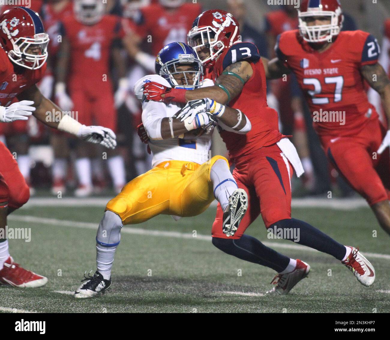 Fresno State's Derron Smith tackles San Jose State's Tim Crawley during ...