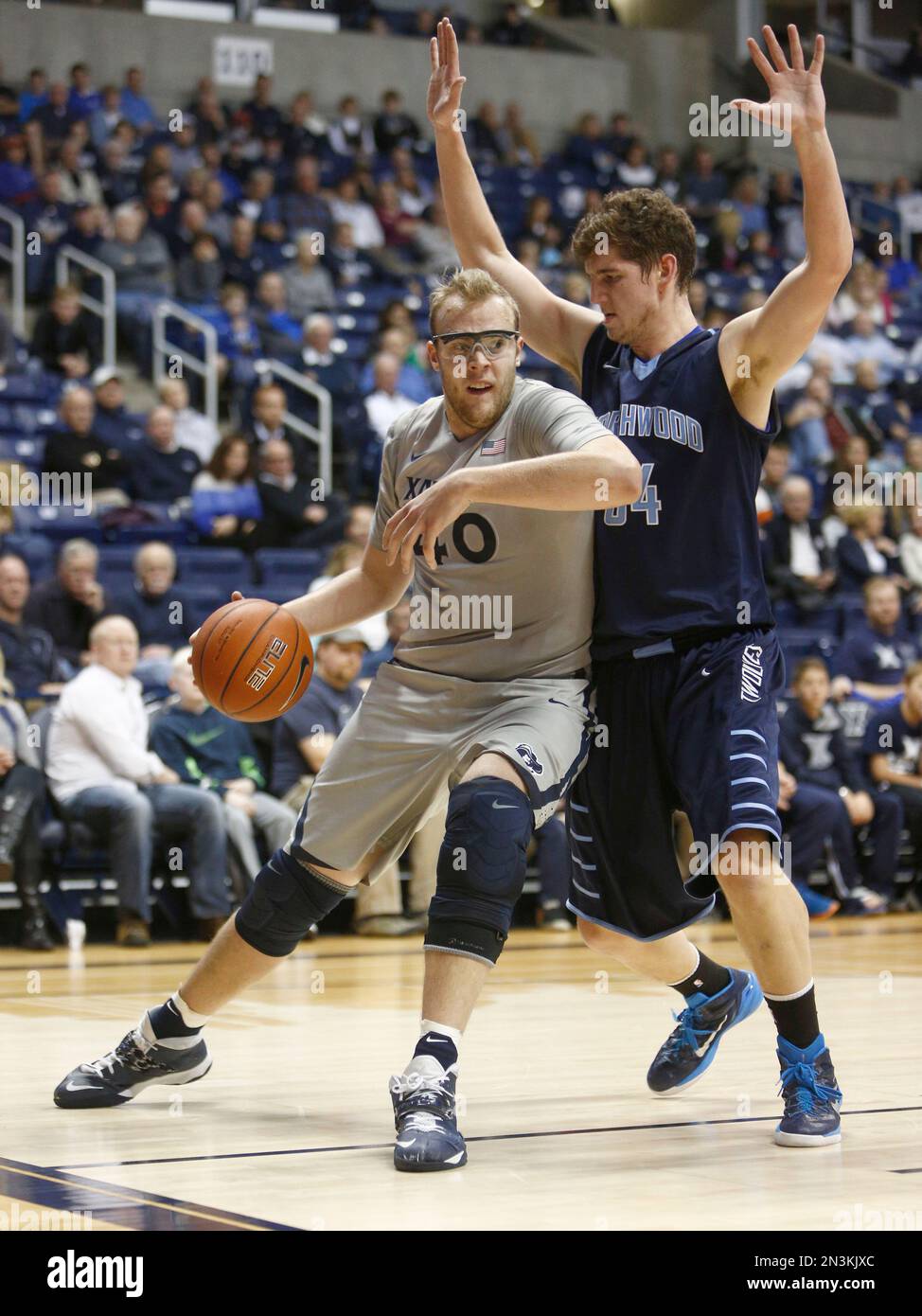 Xavier center Matt Stainbrook (40) is pressured by Northwood forward ...