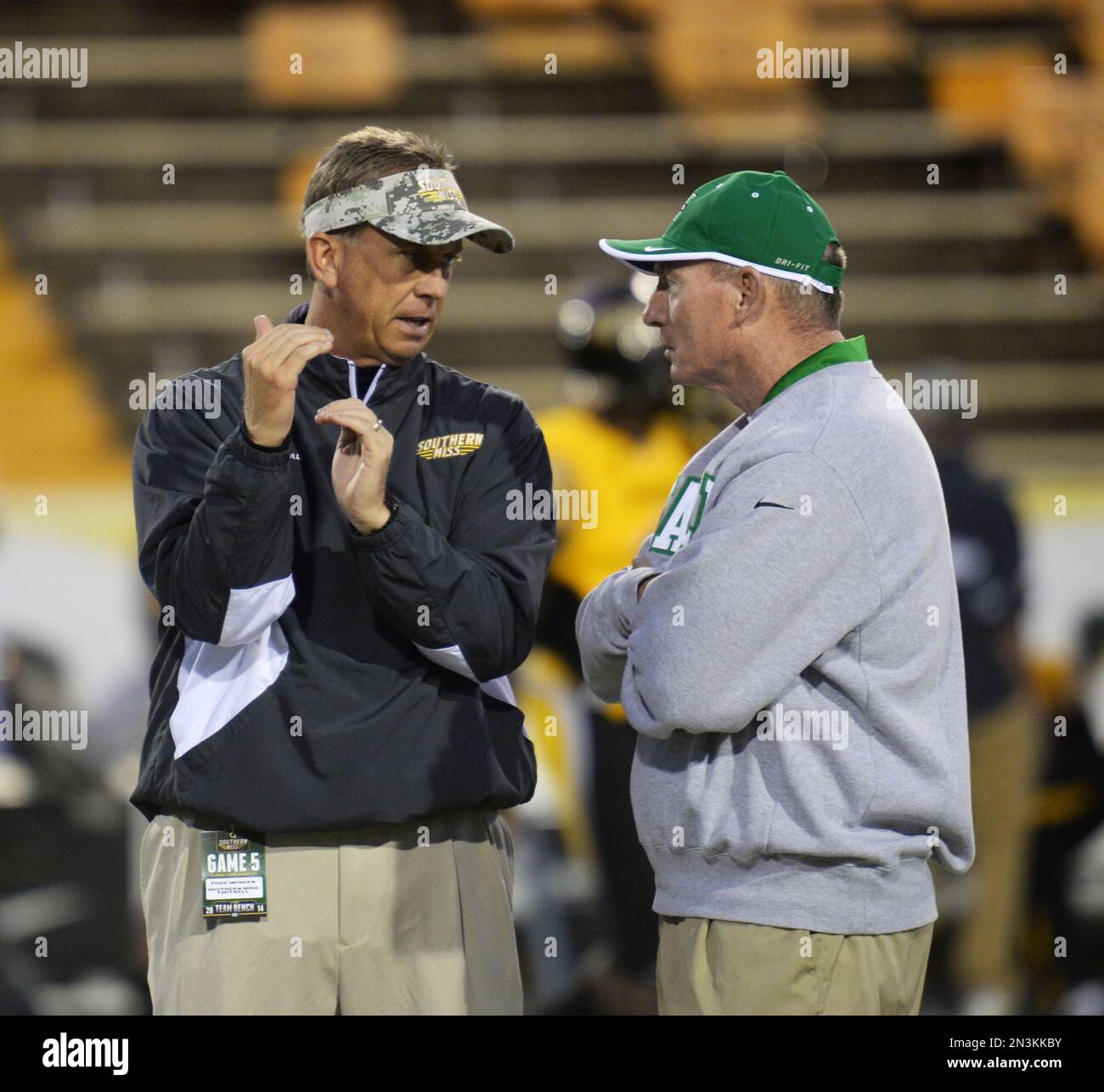 Southern Miss coach Todd Monken and Marshall coach Doc Holliday talk on ...