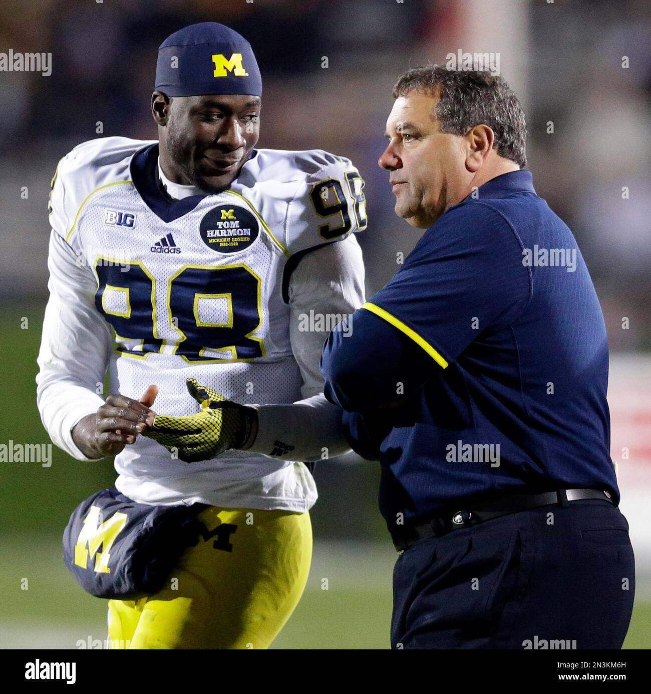 Michigan quarterback Devin Gardner (98) smiles as he talks with head ...
