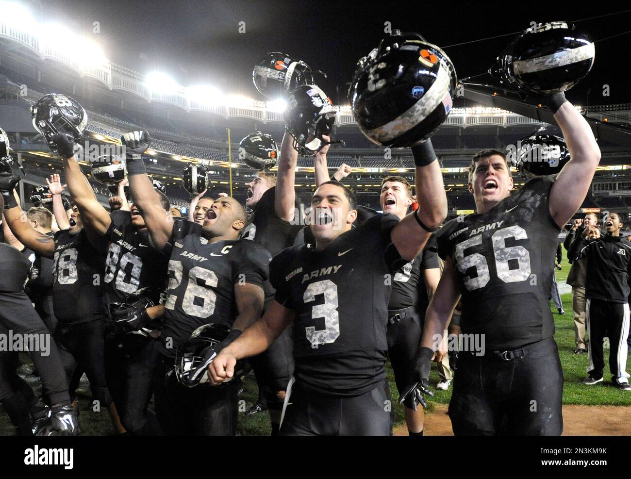 Army quarterback Angel Santiago (3), Larry Dixon (26), and Wyatt ...