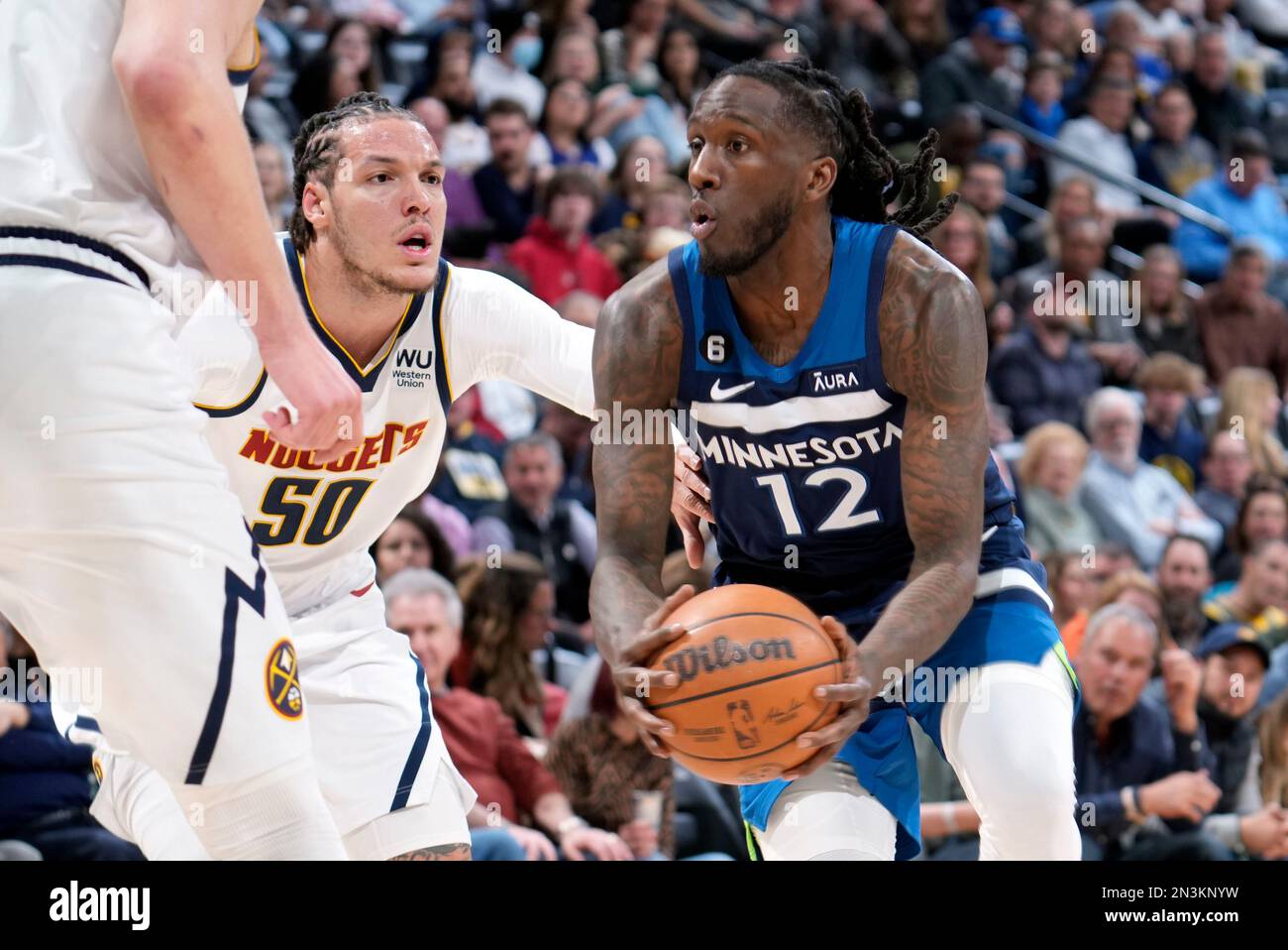Minnesota Timberwolves forward Taurean Prince, right, drives to the rim ...