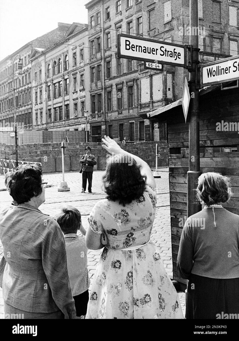 FILE - The Aug. 13, 1962 file photo shows West Berliners waving to relatives in East Berlin one ...