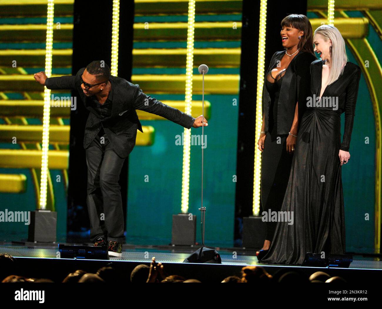 Bill Bellamy, from left, Toccara Jones and Ivy Levan speak on stage ...