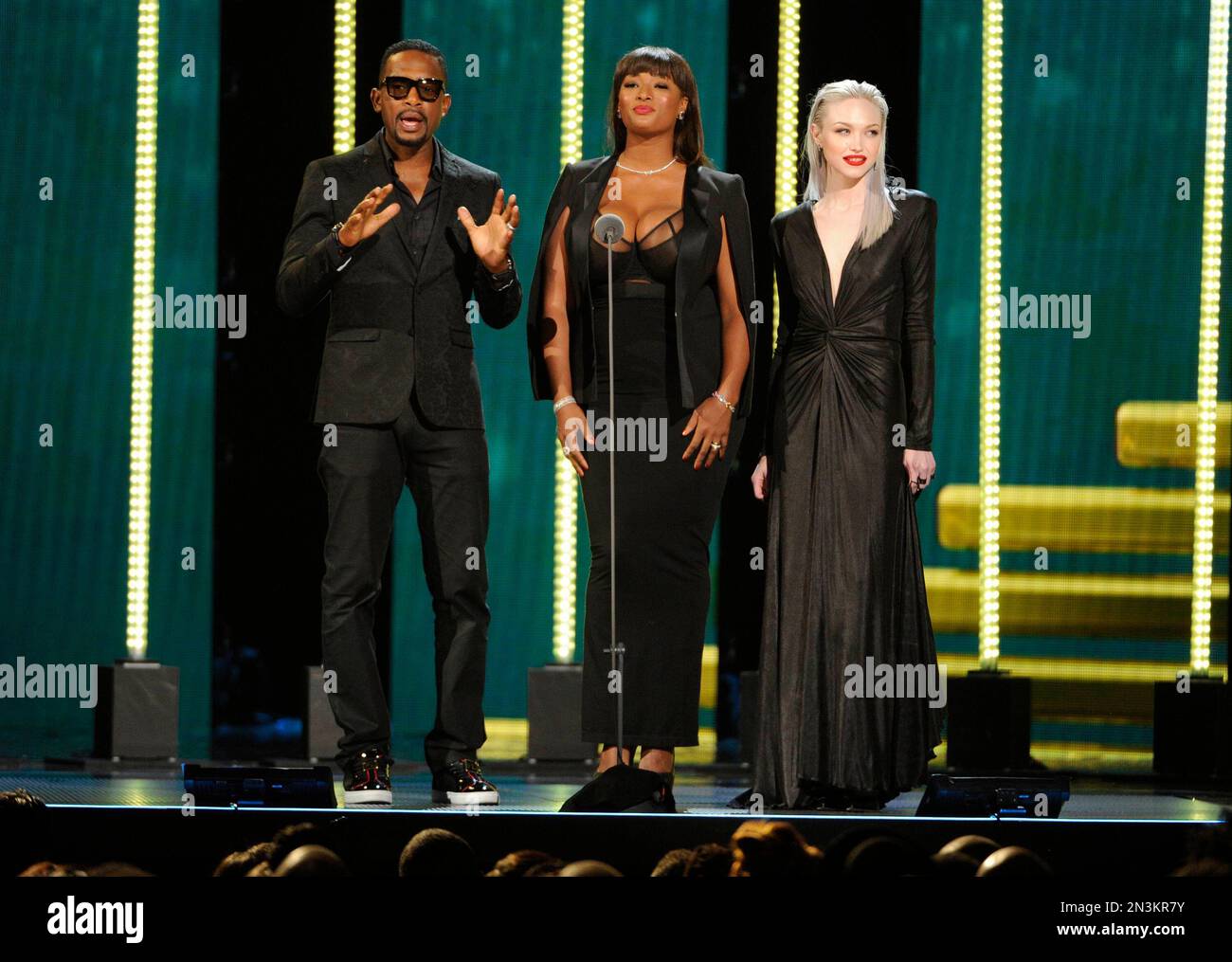 Bill Bellamy, from left, Toccara Jones and Ivy Levan speak on stage ...