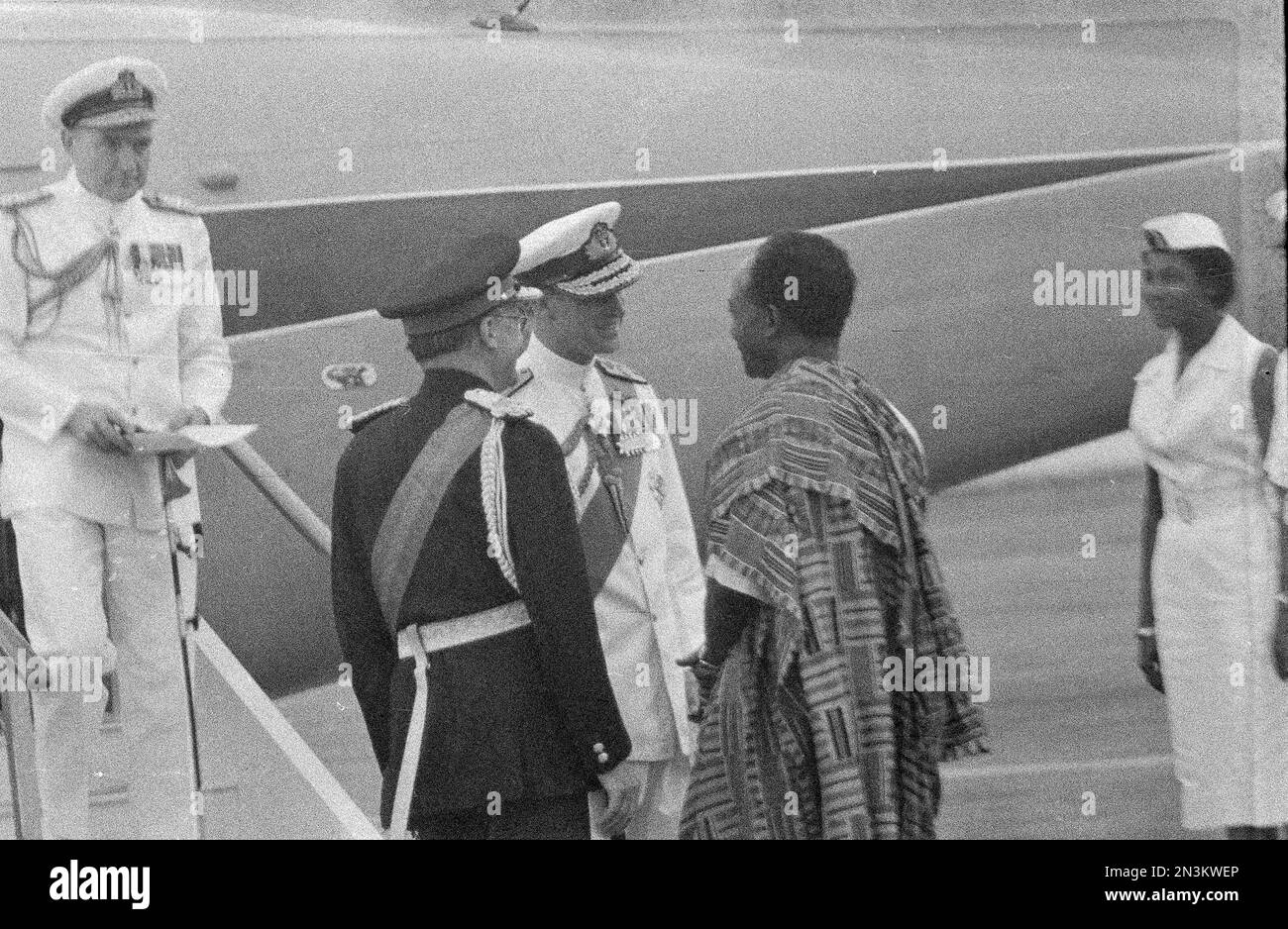 Prince Philip, Duke of Edinburgh, center, is greeted by Ghana's Premier ...