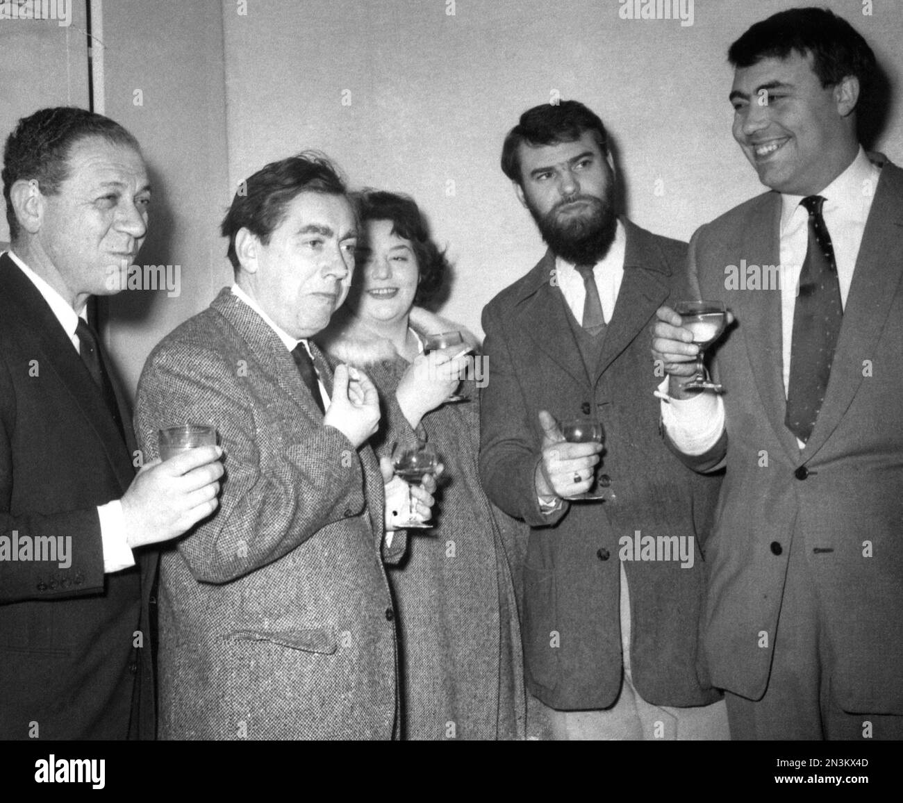 British Radio and screen comedian Tony Hancock poses with his team of ...