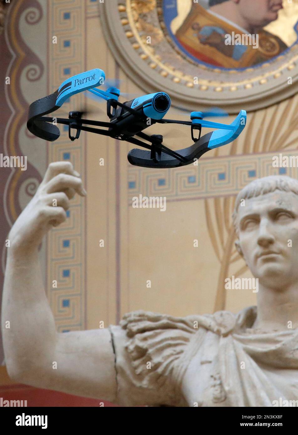 The new Bebop Parrot drone flies front of a Rome marble statue "August ...