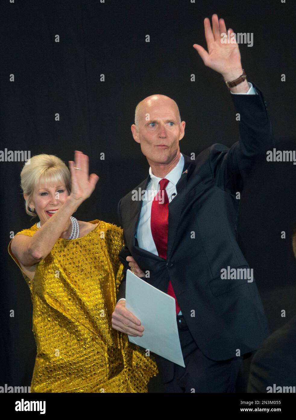 Florida Gov. Rick Scott and his wife Ann wave to the crowd after Scott ...