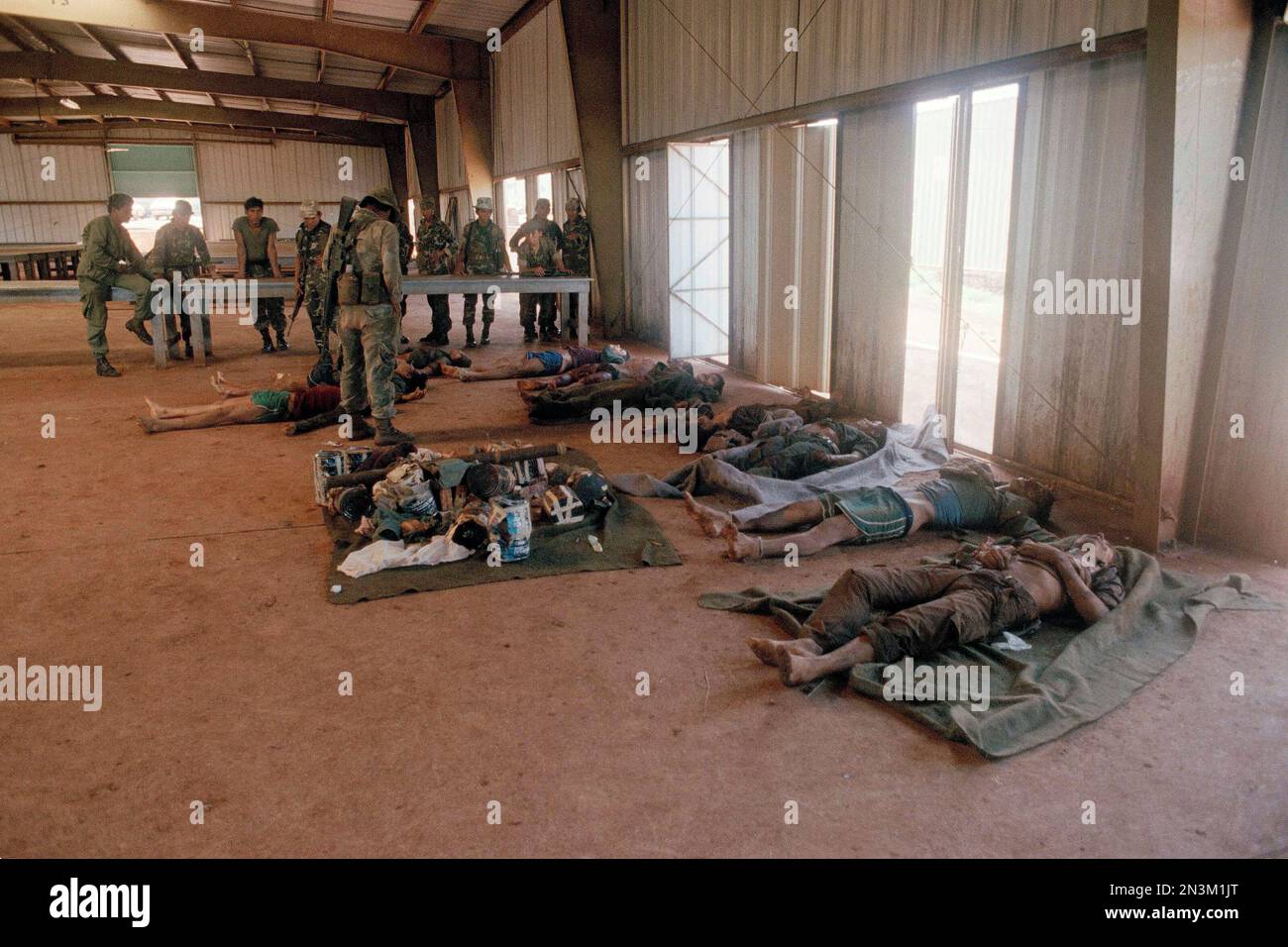 The bodies of Salvadoran military trainees are laid out after they were ...