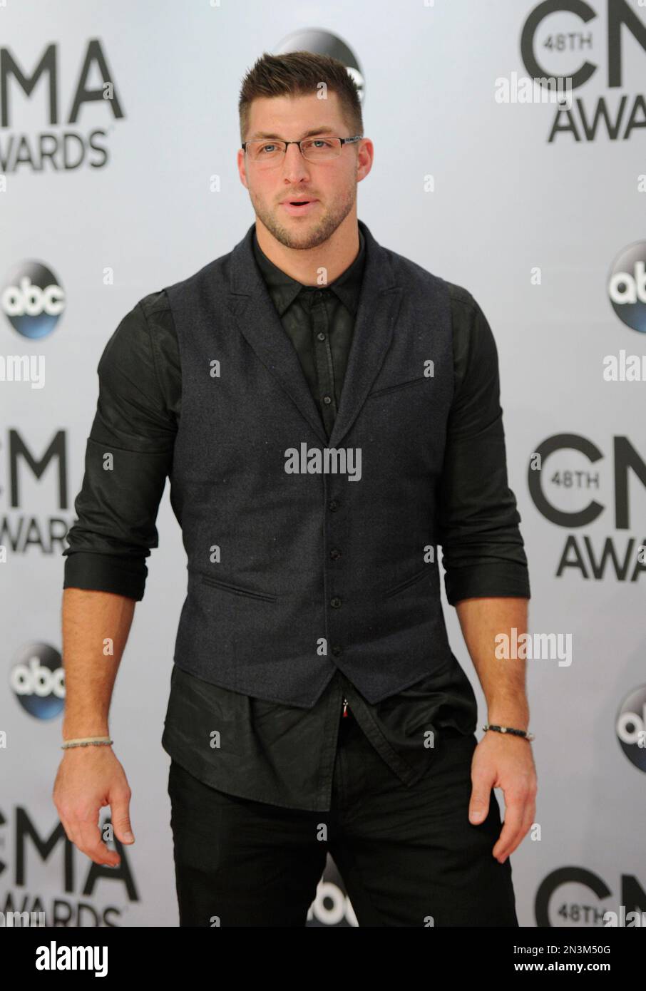 Tim Tebow arrives at the 48th annual CMA Awards at the Bridgestone ...